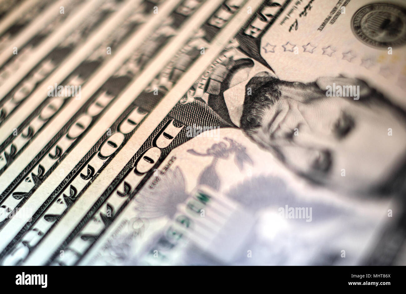 Dollar bills of different denominations background Stock Photo - Alamy