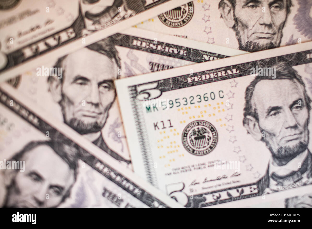 Dollar bills of different denominations background Stock Photo - Alamy