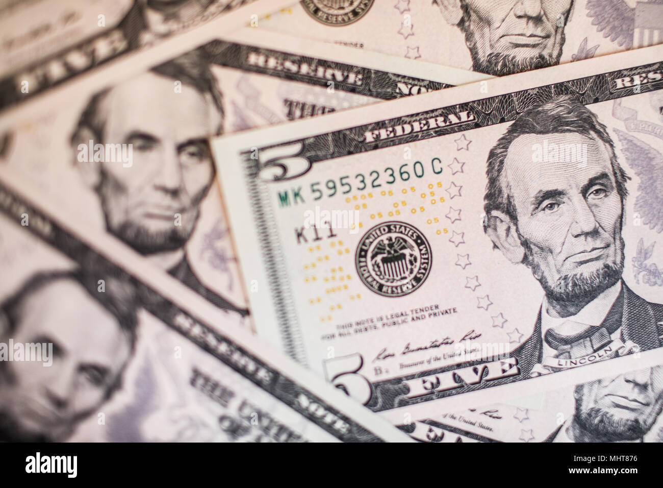 Dollar bills of different denominations background Stock Photo - Alamy