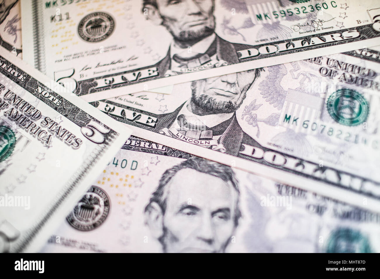 Dollar bills of different denominations background Stock Photo - Alamy