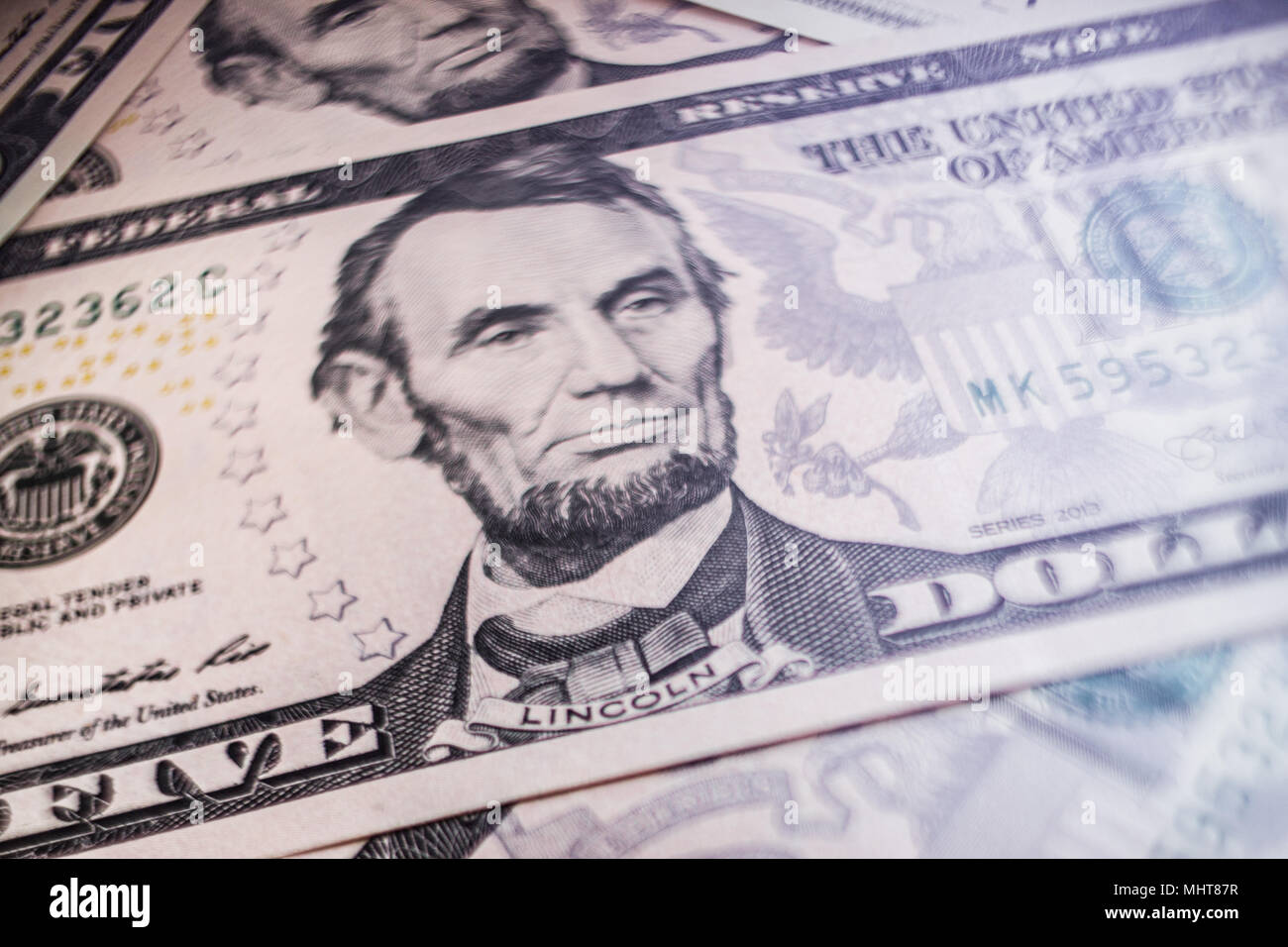 Dollar bills of different denominations background Stock Photo - Alamy