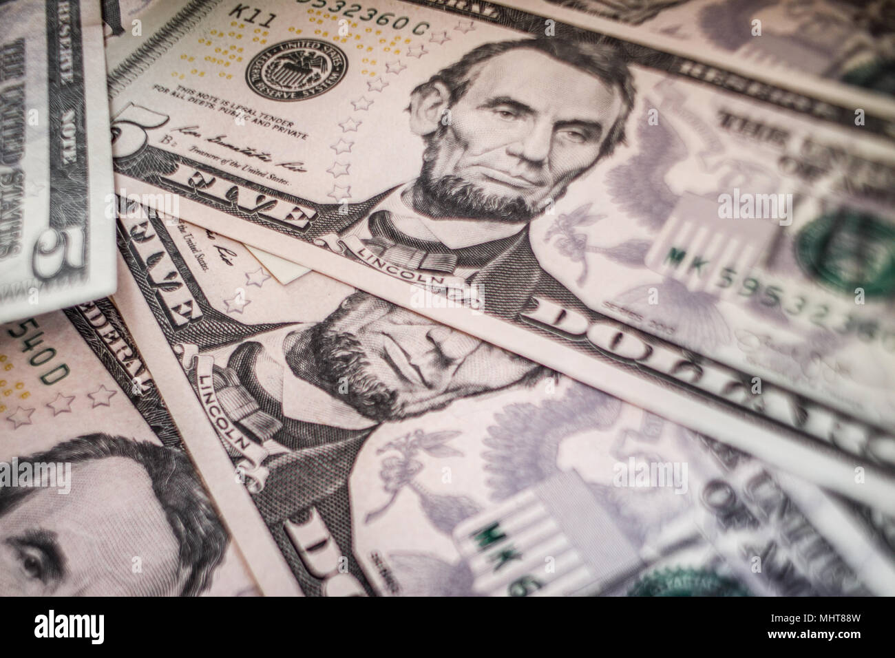 Dollar bills of different denominations background Stock Photo - Alamy