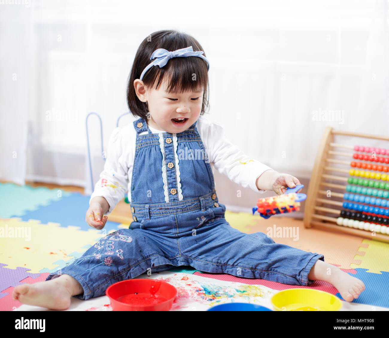 baby girl painting at home Stock Photo - Alamy