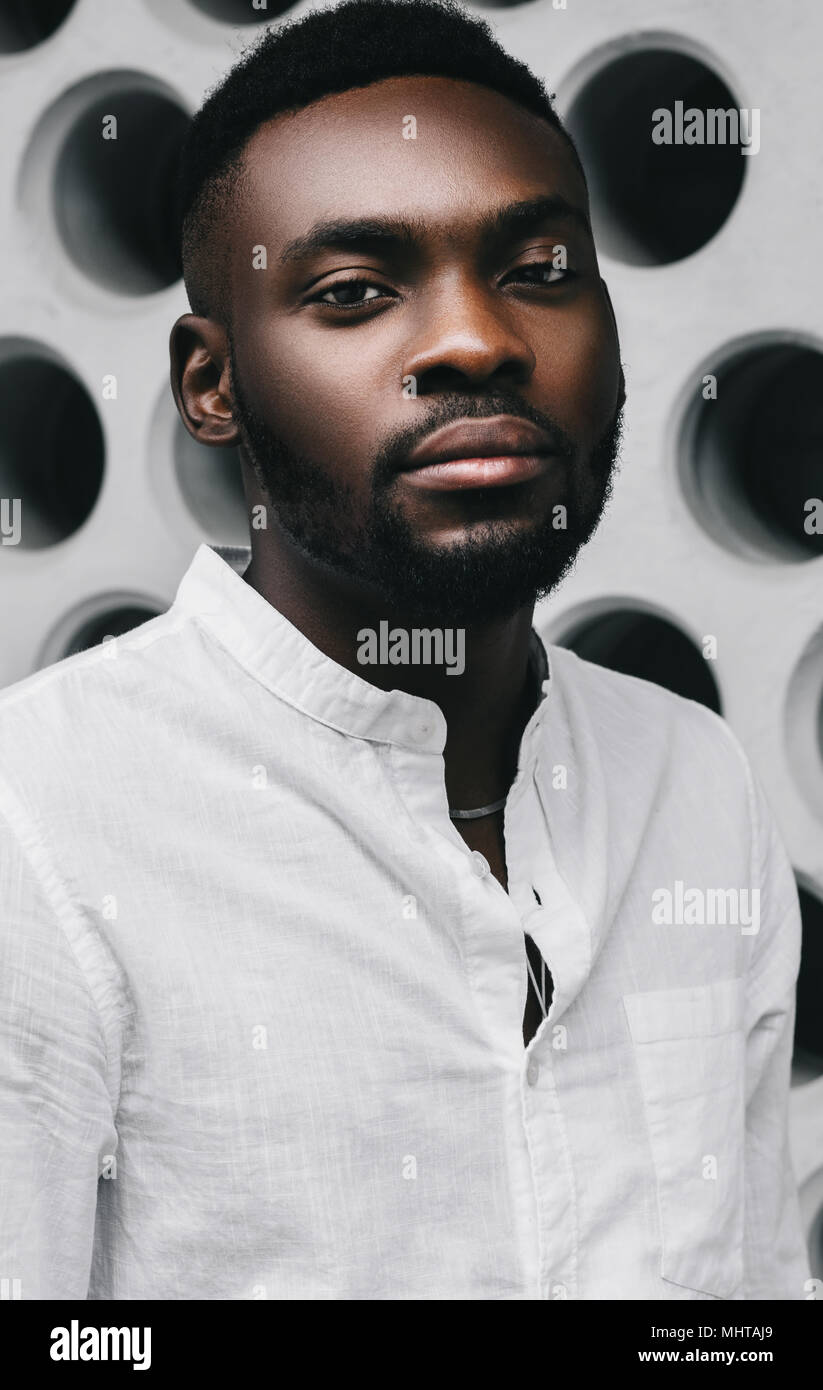Portrait of a fashionable african american man on gray background Stock ...