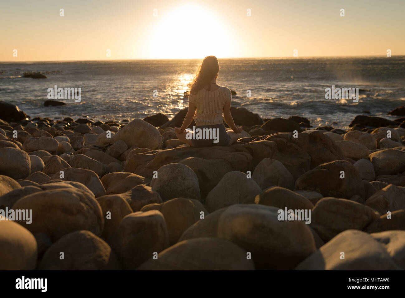 Meditation on the rock hi-res stock photography and images - Alamy