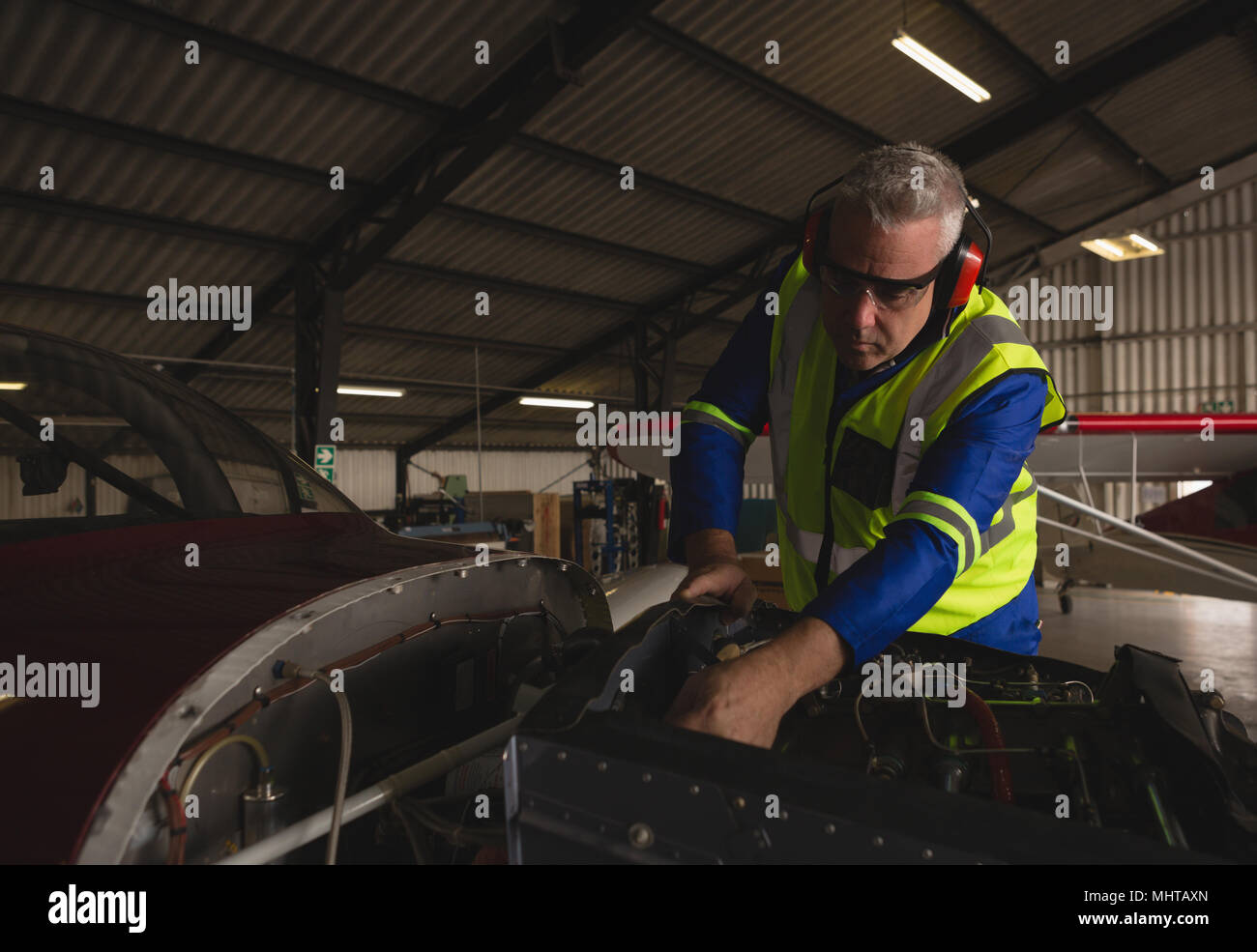 Engineer checking aircraft engine Stock Photo - Alamy