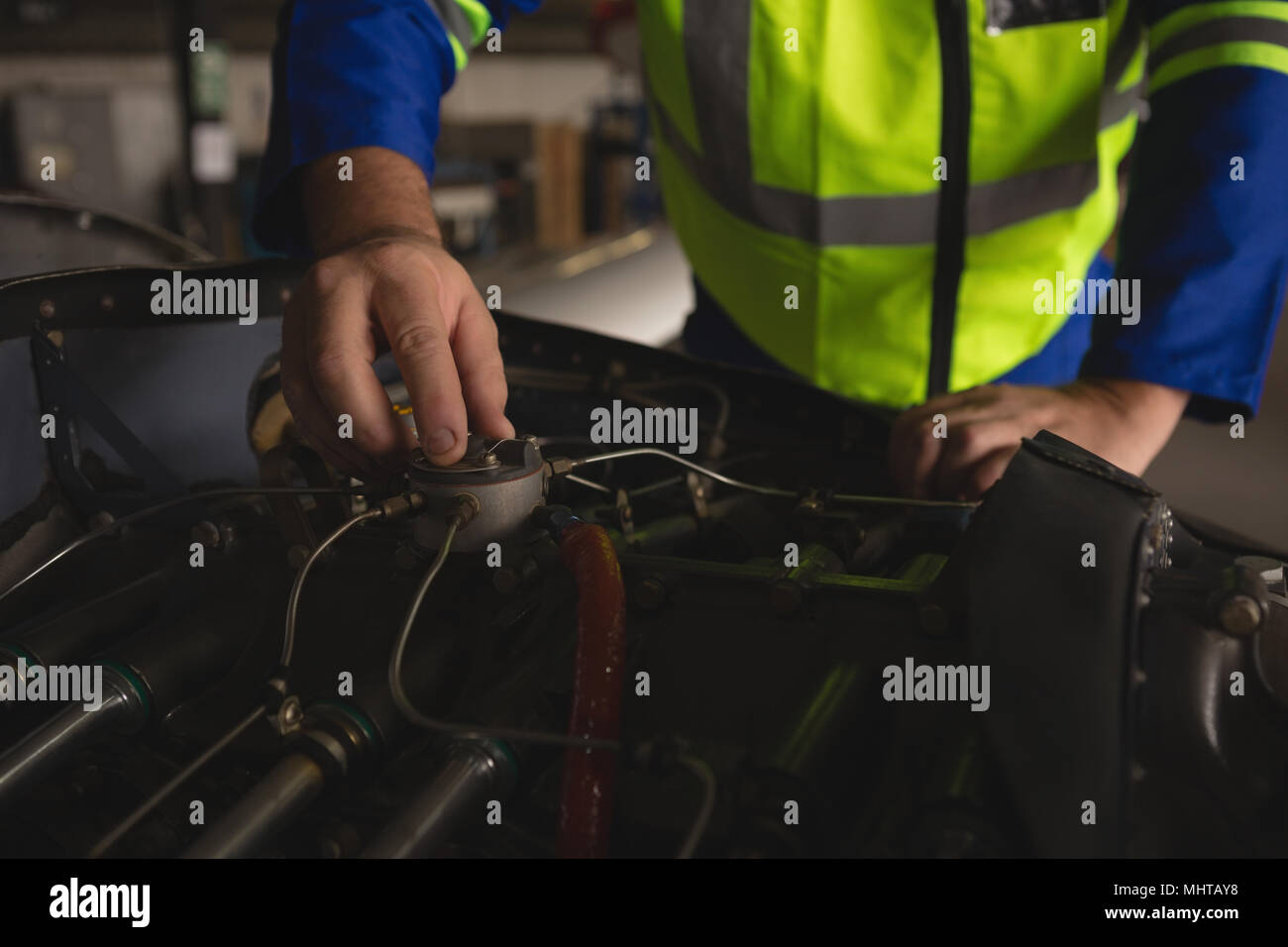 Engineer repairing aircraft engine Stock Photo - Alamy