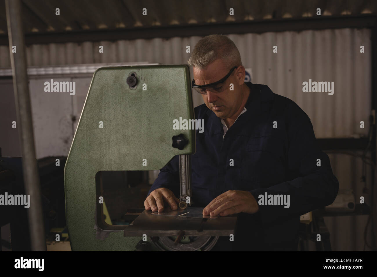 Male mechanic checking spare parts hi-res stock photography and images ...
