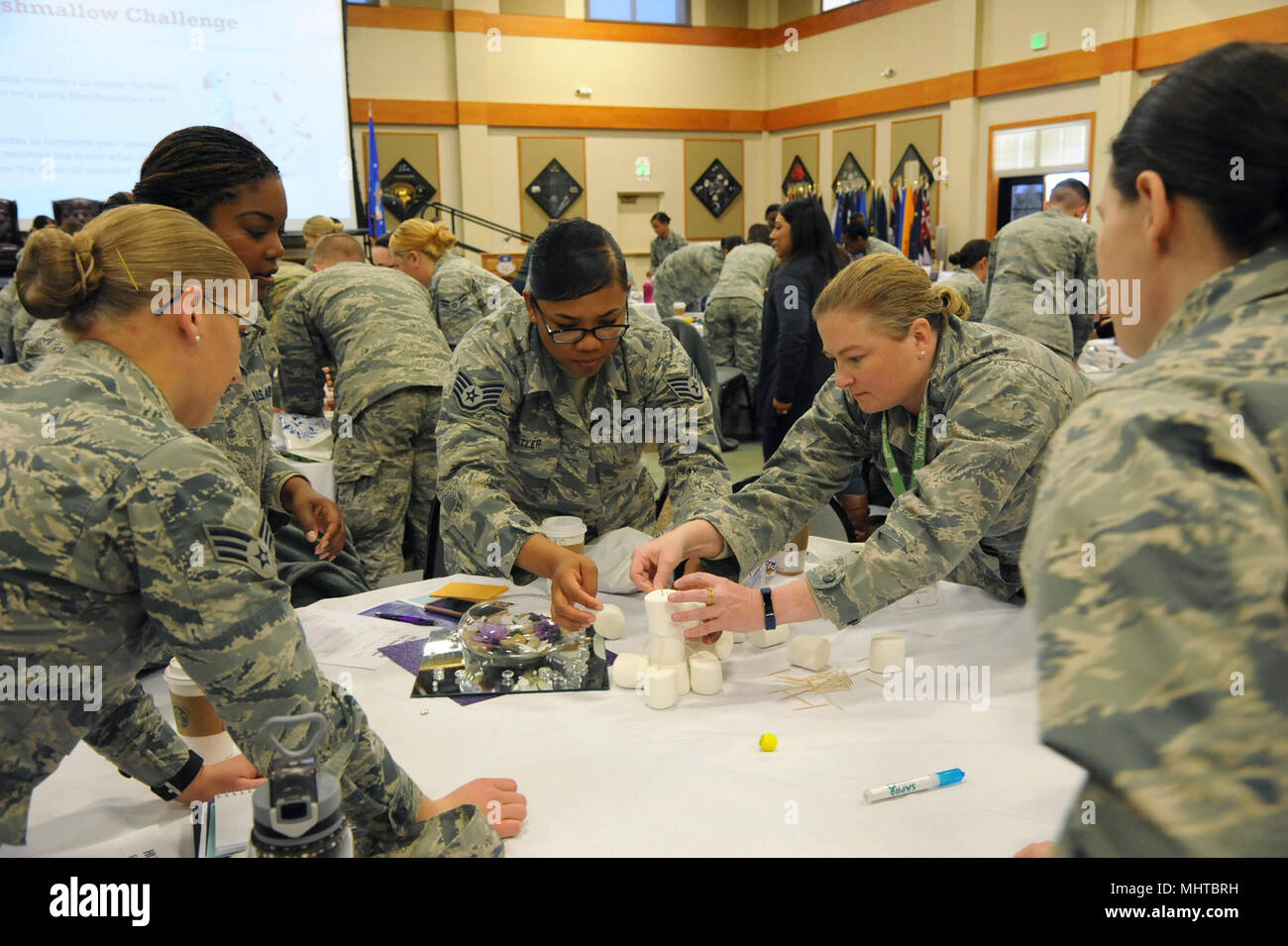 Tables of Airmen work together to create a freestanding tower using ...