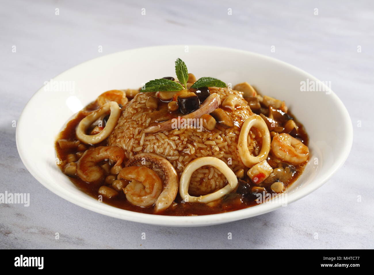 seafood abalone sauce over rice Stock Photo - Alamy