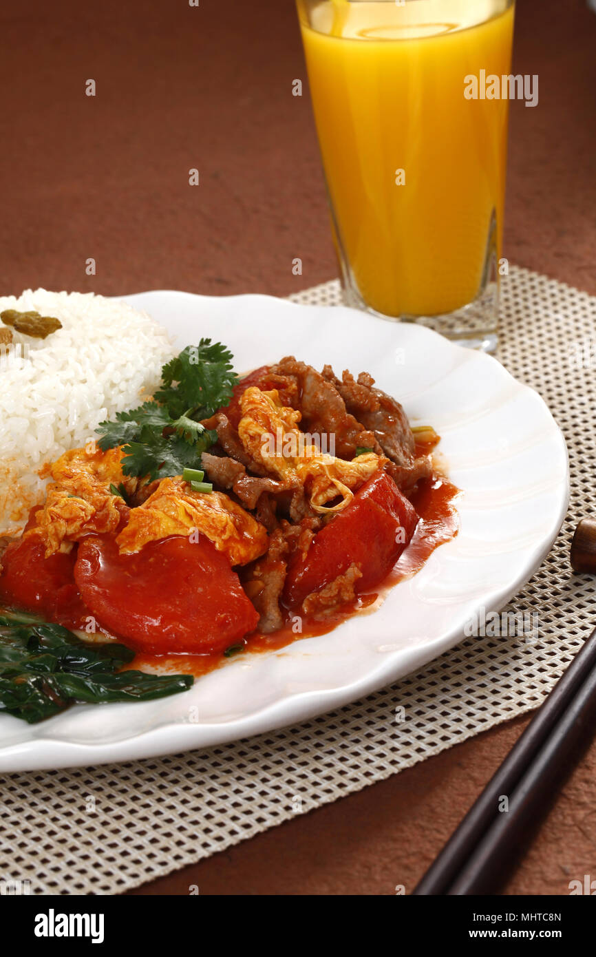 tomato beef over rice Stock Photo - Alamy