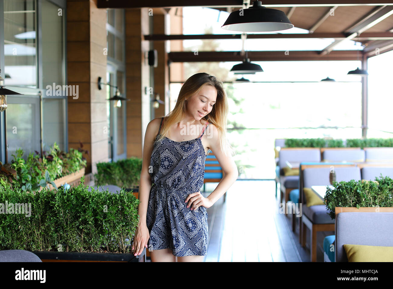 Girl standing cafe near hi-res stock photography and images - Alamy