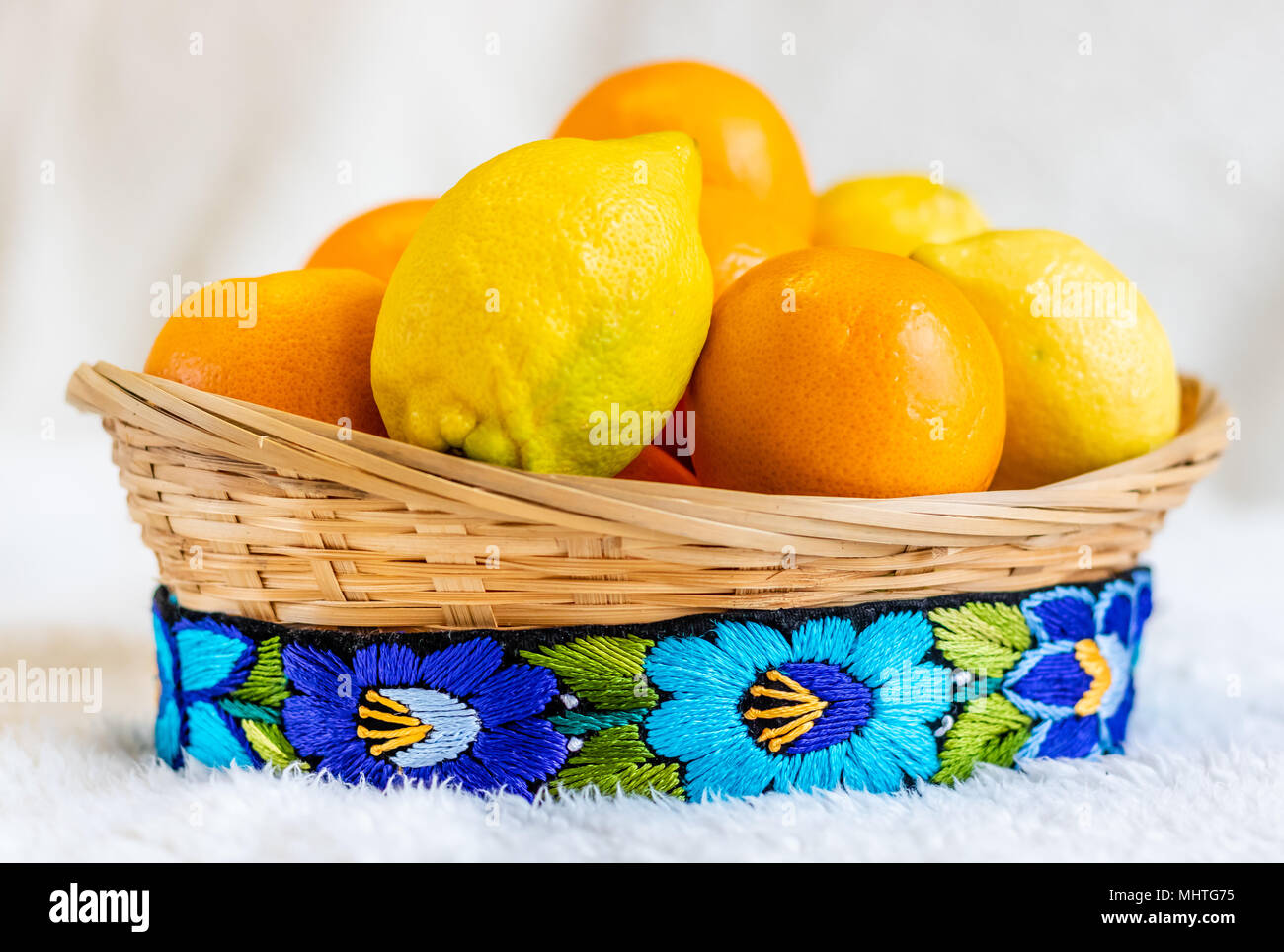 Basket full of acid fruits Stock Photo - Alamy