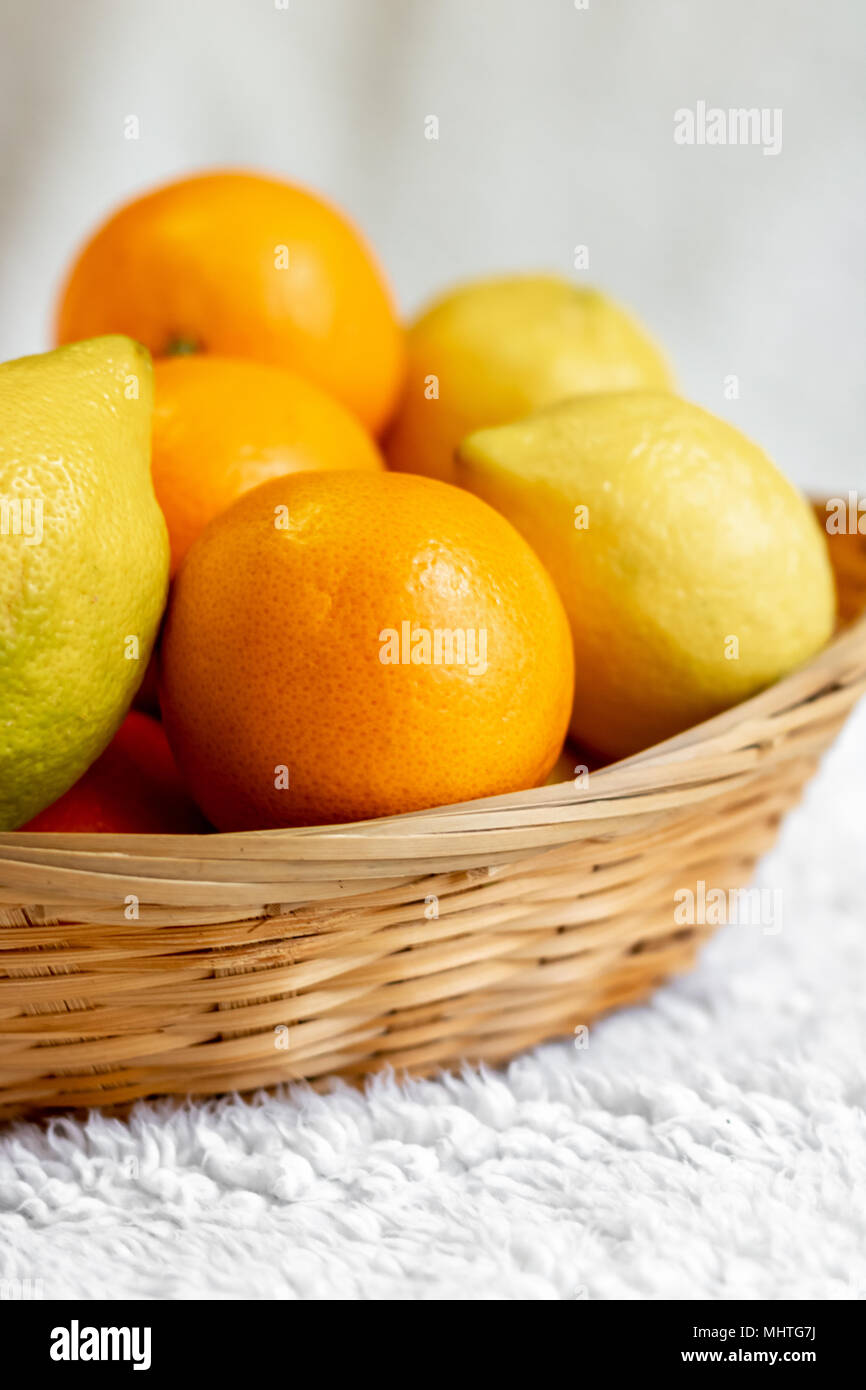 Citrus fruits in a basket Stock Photo - Alamy