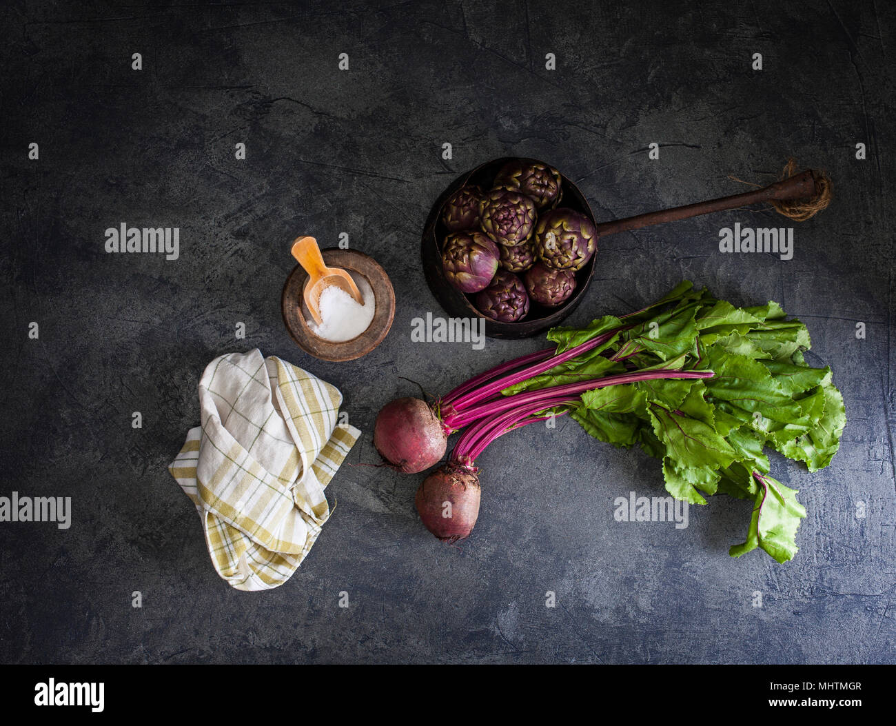 Top view of Red Round Turnip and Artichokes on dark background Stock ...