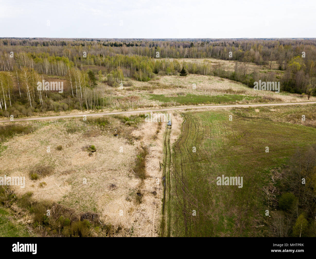 drone image. aerial view of rural area with fields and forests in sunny ...