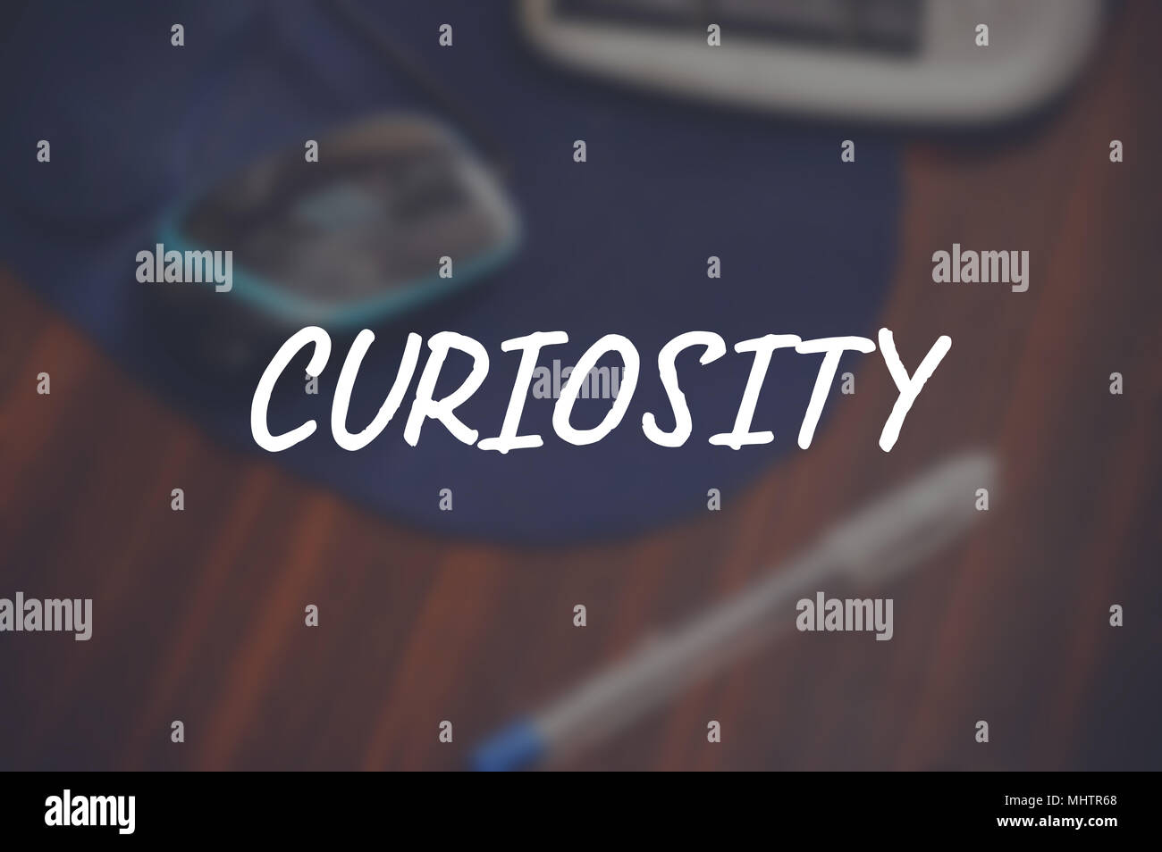 Curiosity word with blurring business background Stock Photo - Alamy