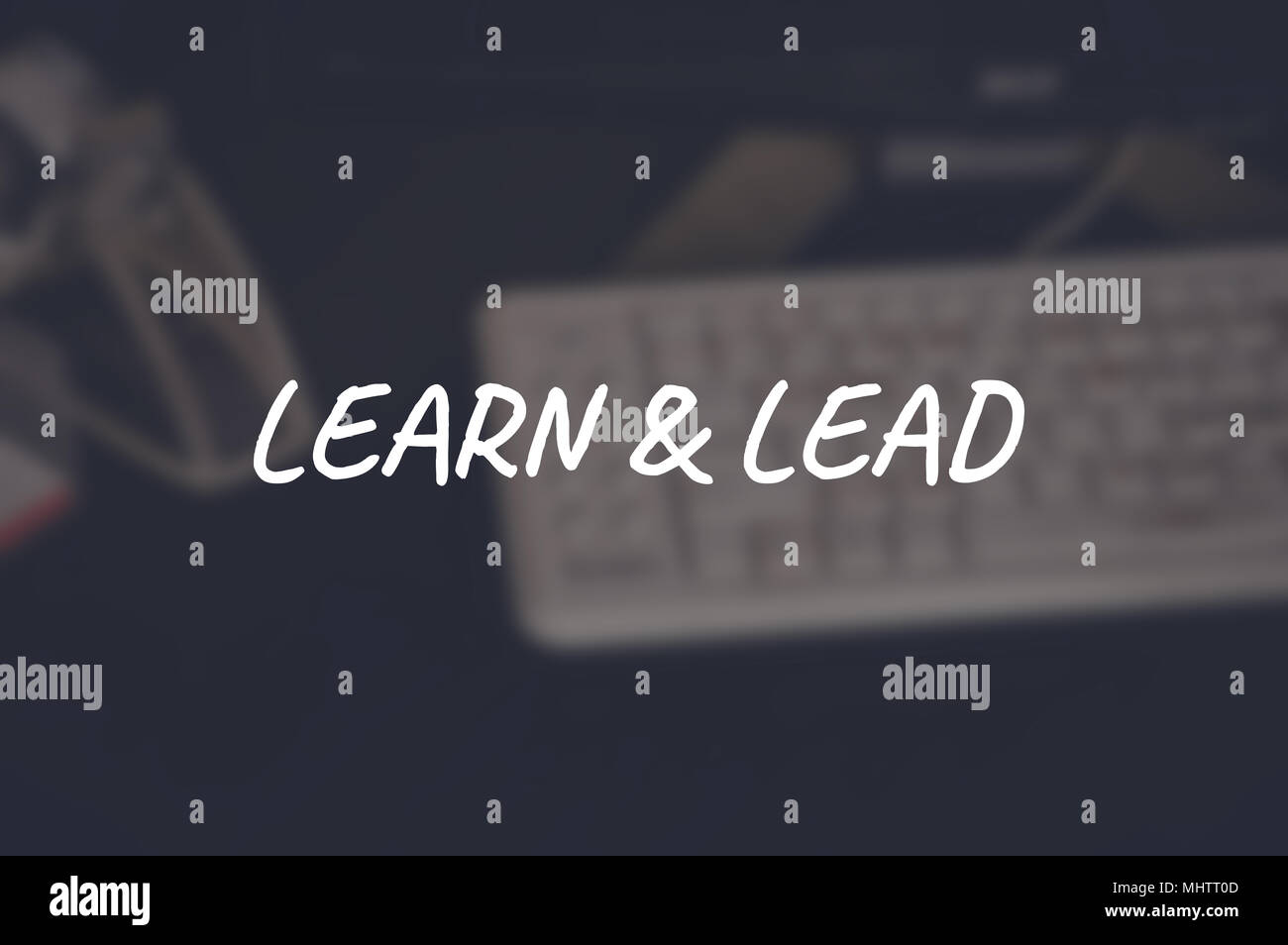 Learn and lead word with blurring business background Stock Photo - Alamy