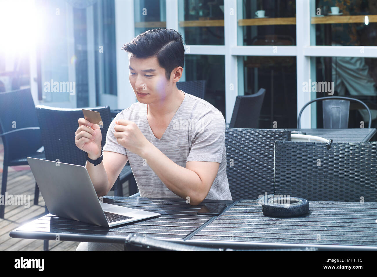 Young men online shopping Stock Photo - Alamy