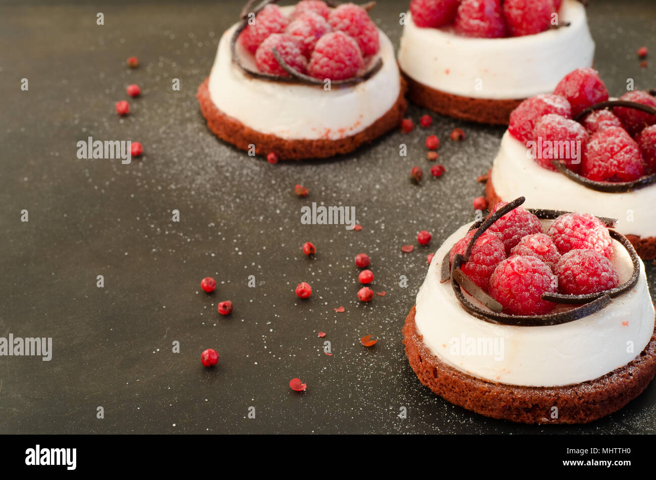 Cheesecake with raspberry on dark border background. Free space for ...