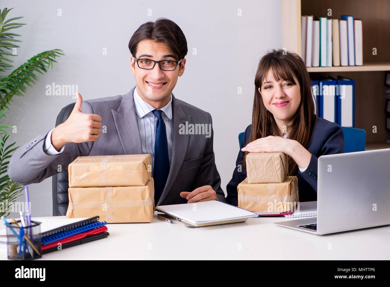 Business people receiving new mail and parcels Stock Photo - Alamy