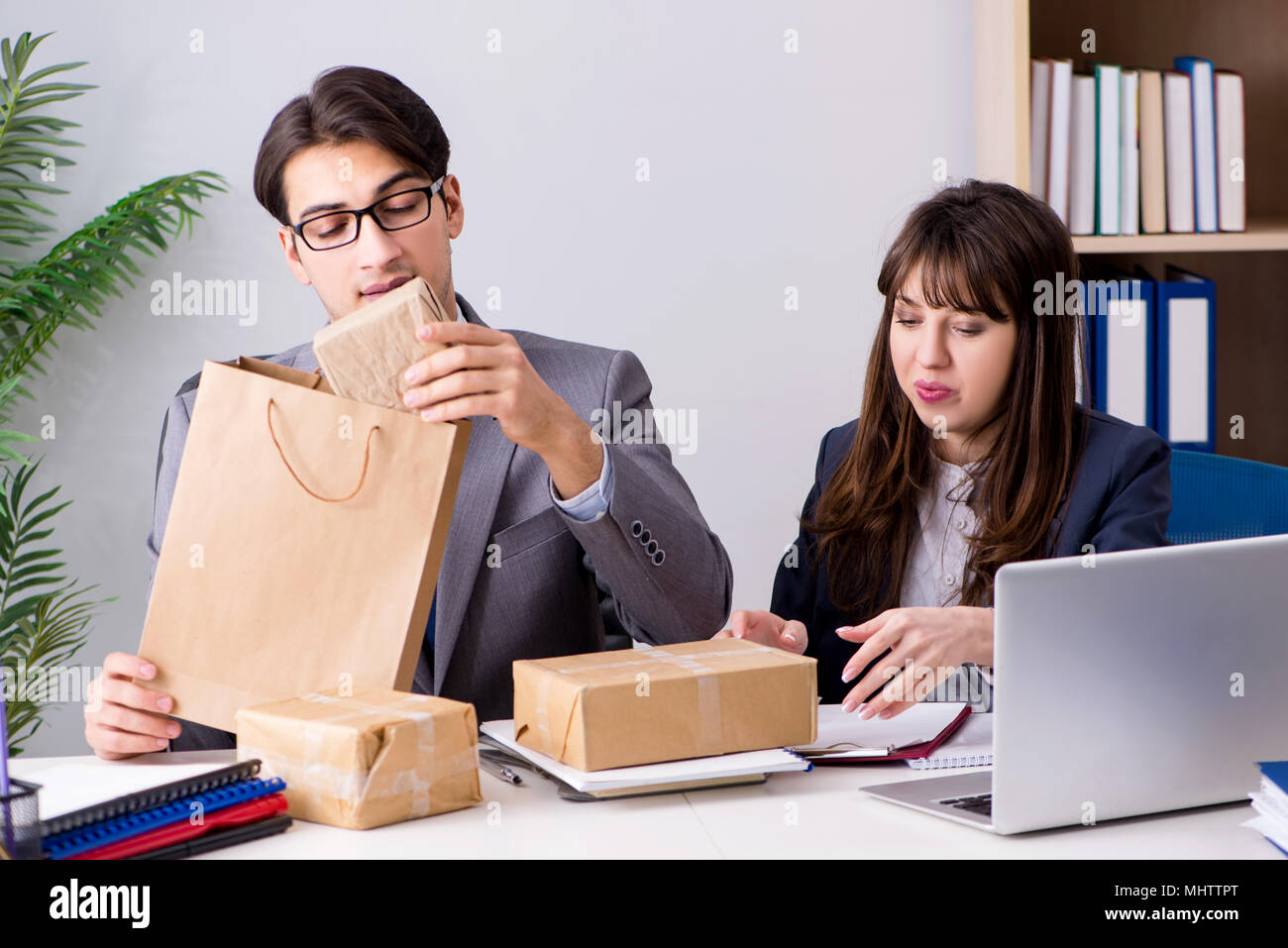 Business people receiving new mail and parcels Stock Photo - Alamy