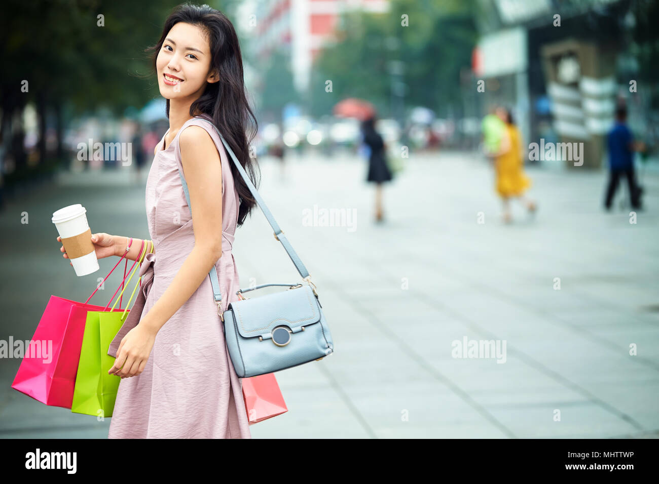 Young women go shopping Stock Photo - Alamy
