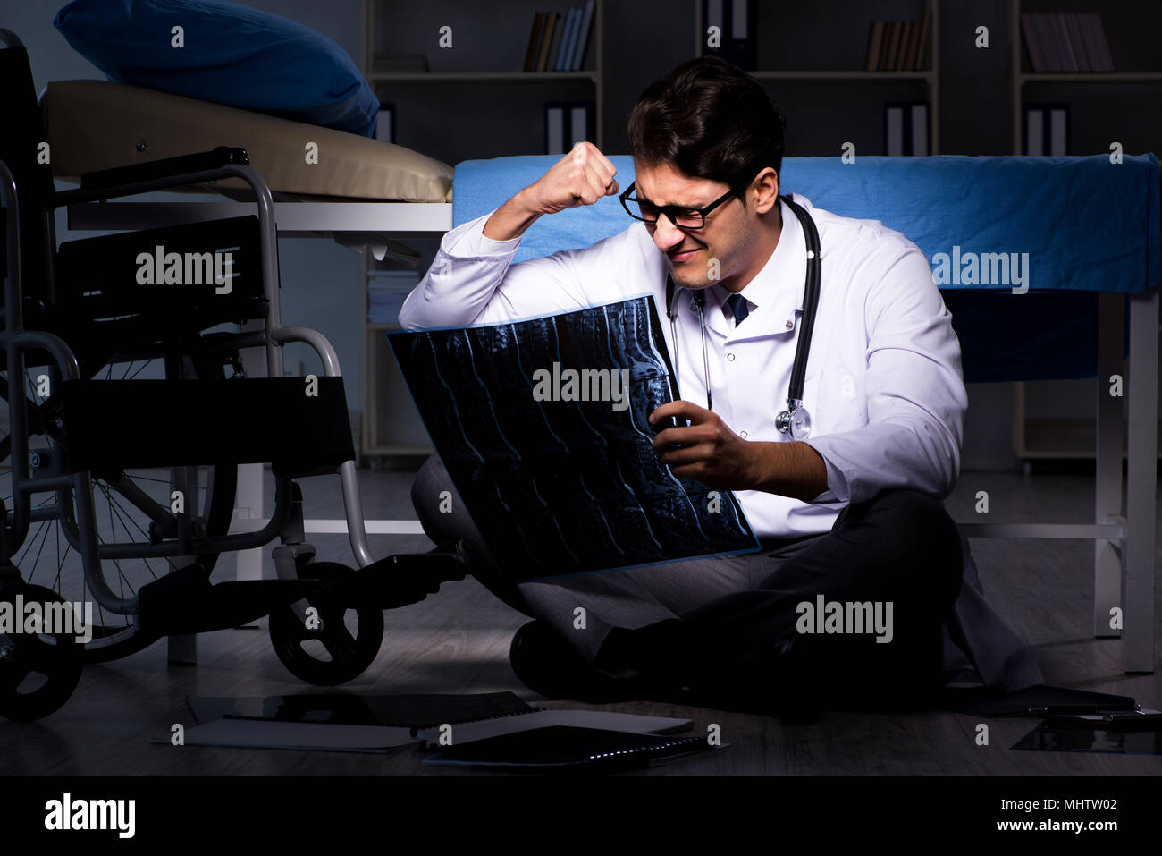 Doctor working night shift in hospital after long hours Stock Photo - Alamy