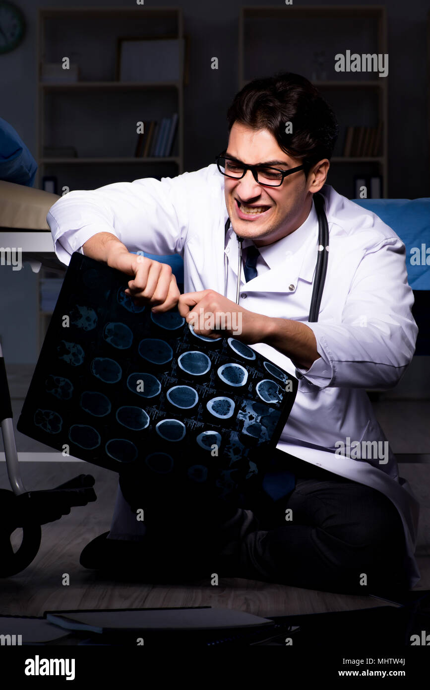 Doctor working long hours hi-res stock photography and images - Alamy
