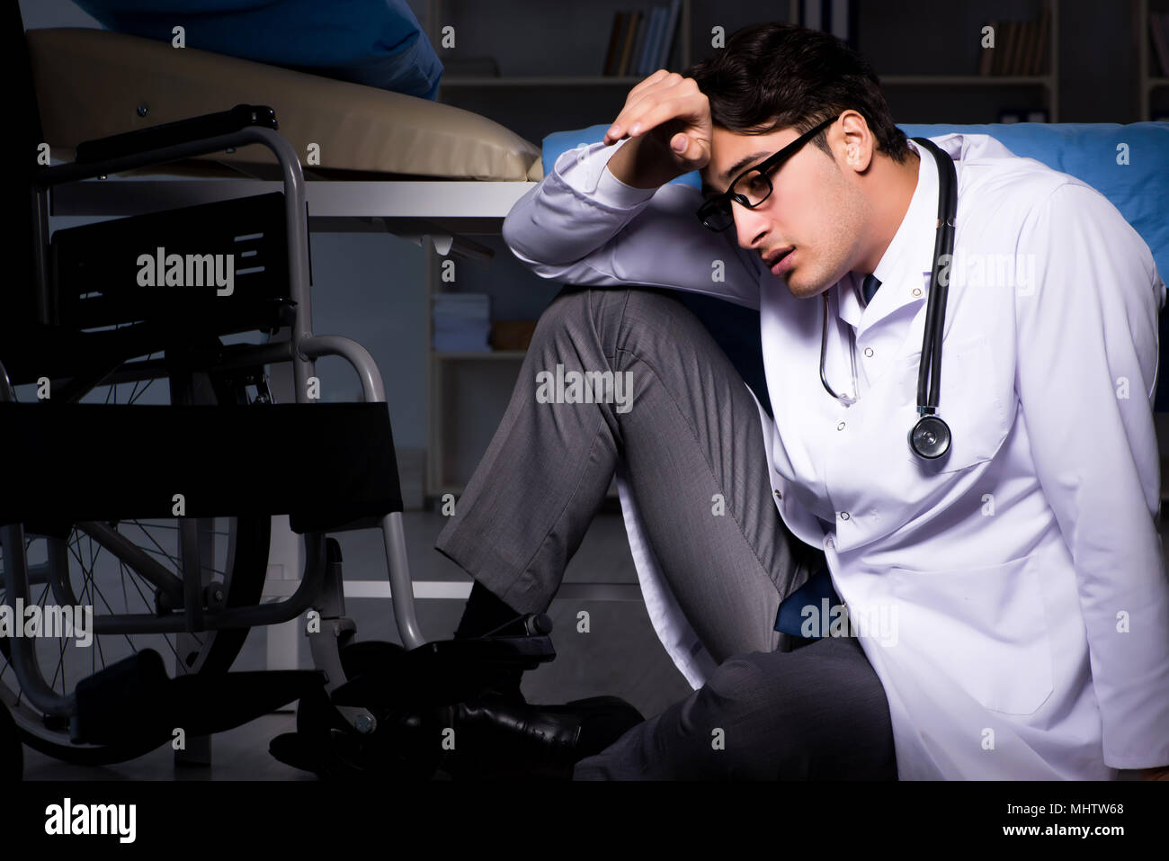 Doctor working night shift in hospital after long hours Stock Photo - Alamy