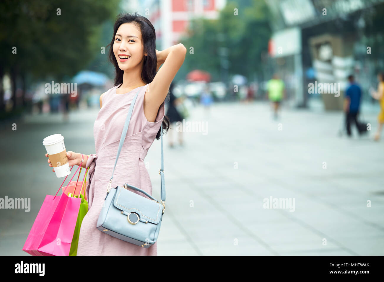 Young women go shopping Stock Photo - Alamy