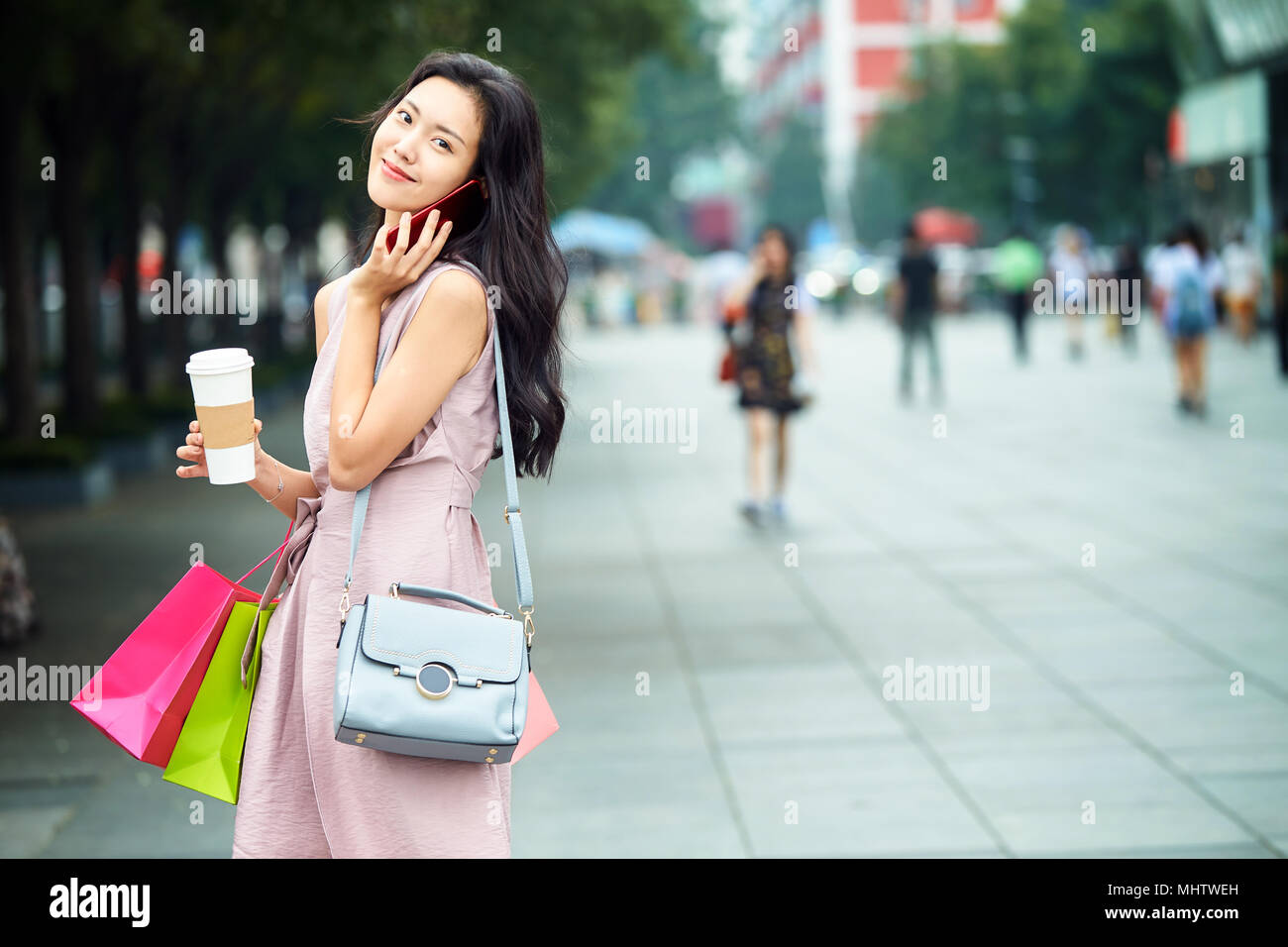 Young women go shopping Stock Photo - Alamy