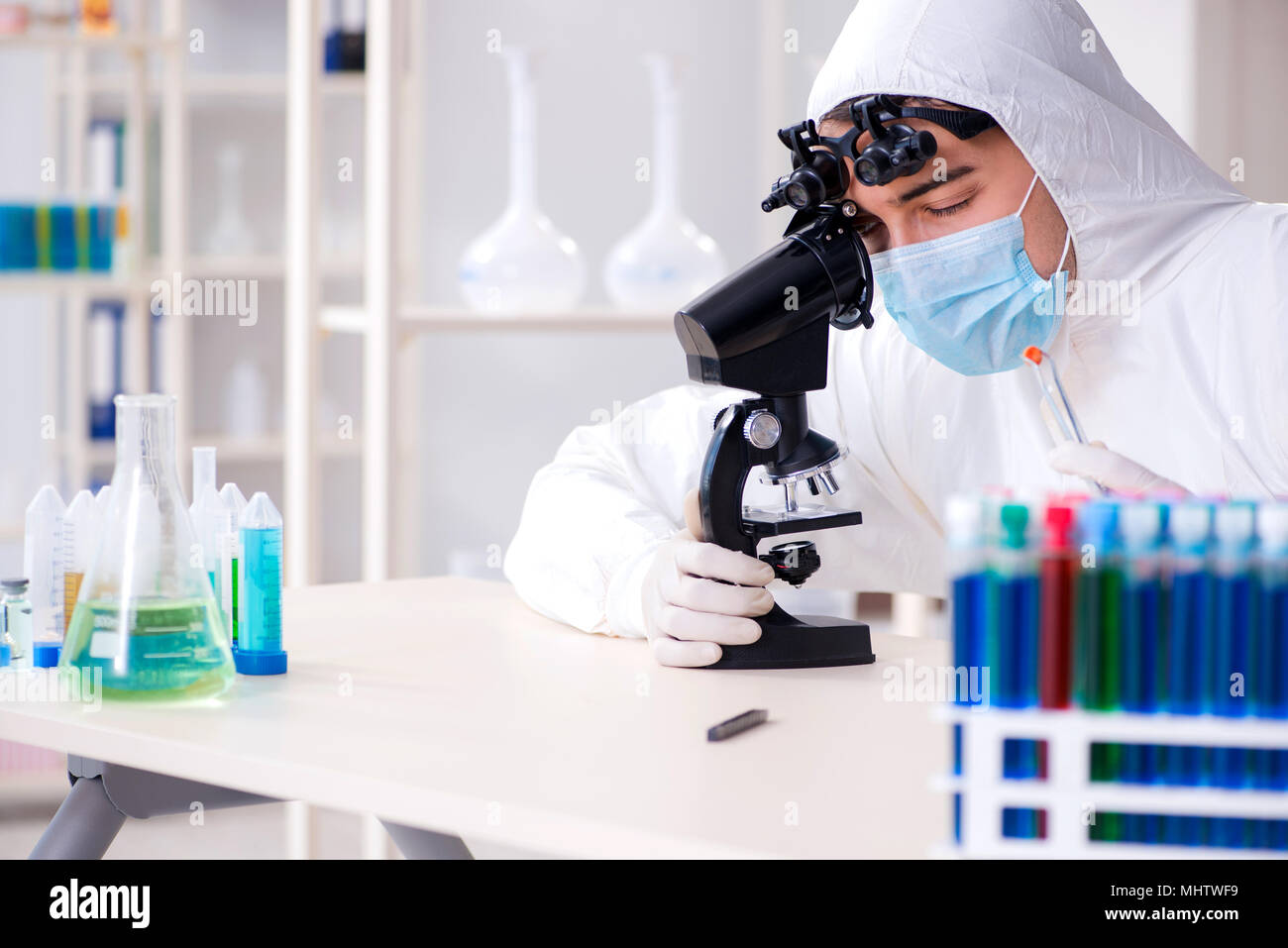 Drug synthesis concept with chemist working in research lab Stock Photo ...