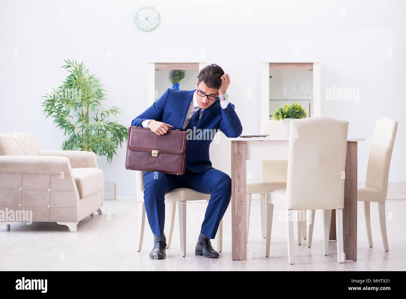Bankrupt businessman angry and upset at home Stock Photo - Alamy