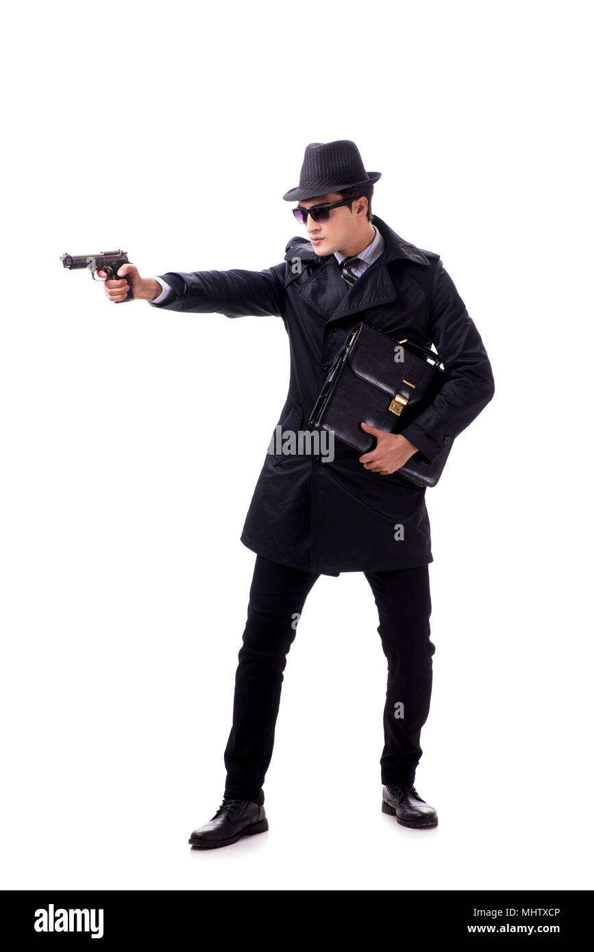 Man spy with handgun isolated on white background Stock Photo - Alamy