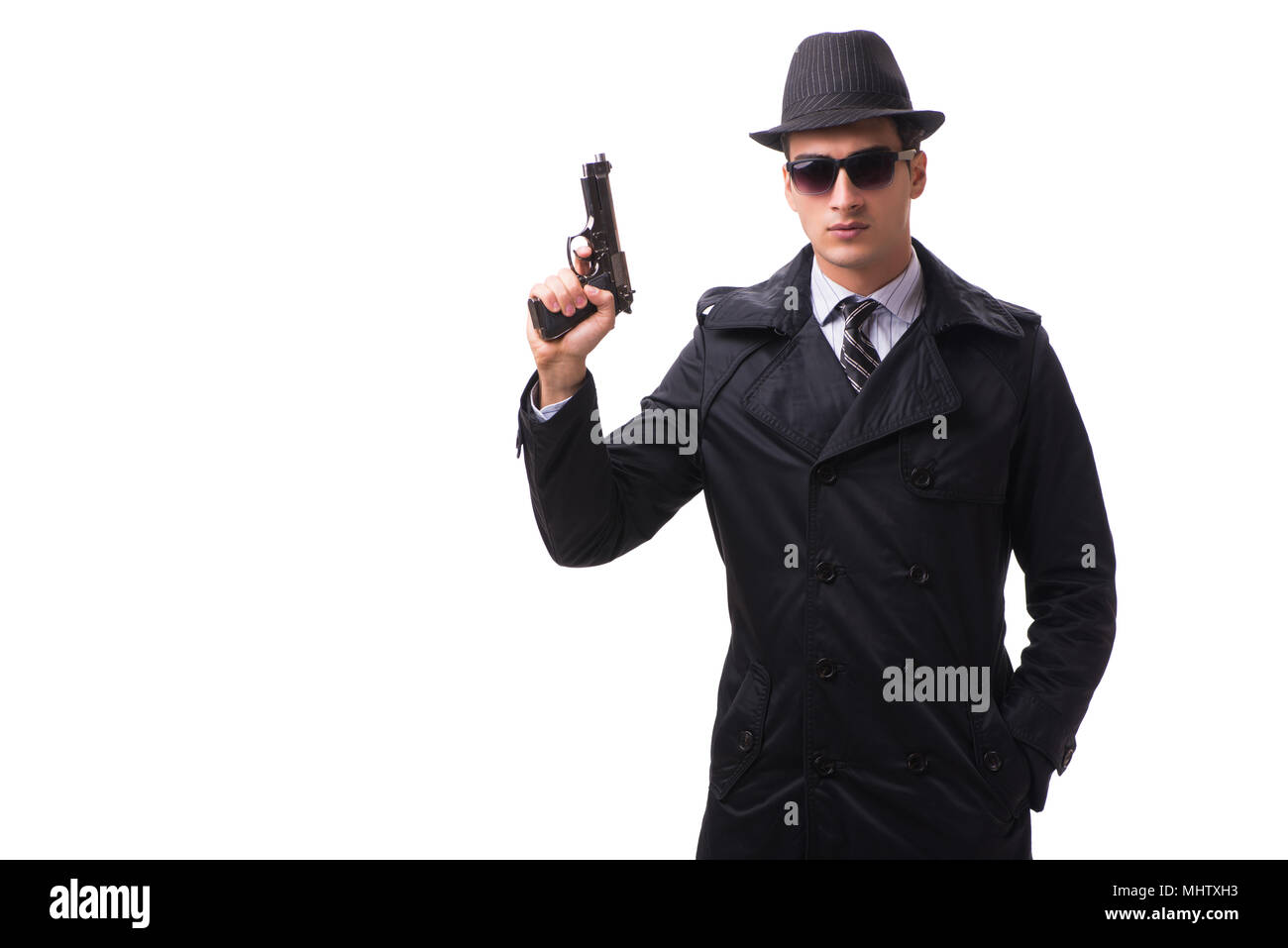 Man spy with handgun isolated on white background Stock Photo - Alamy