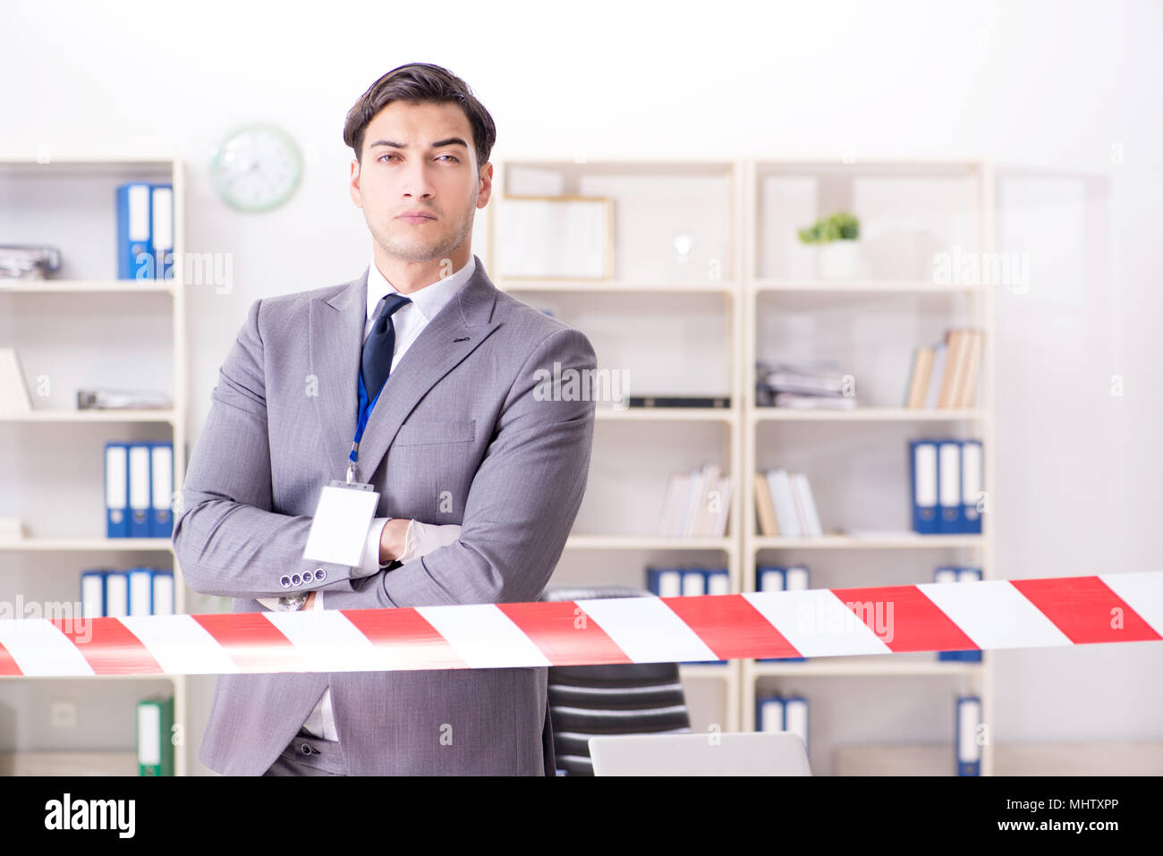 Forensics investigator at the scene of office crime Stock Photo - Alamy