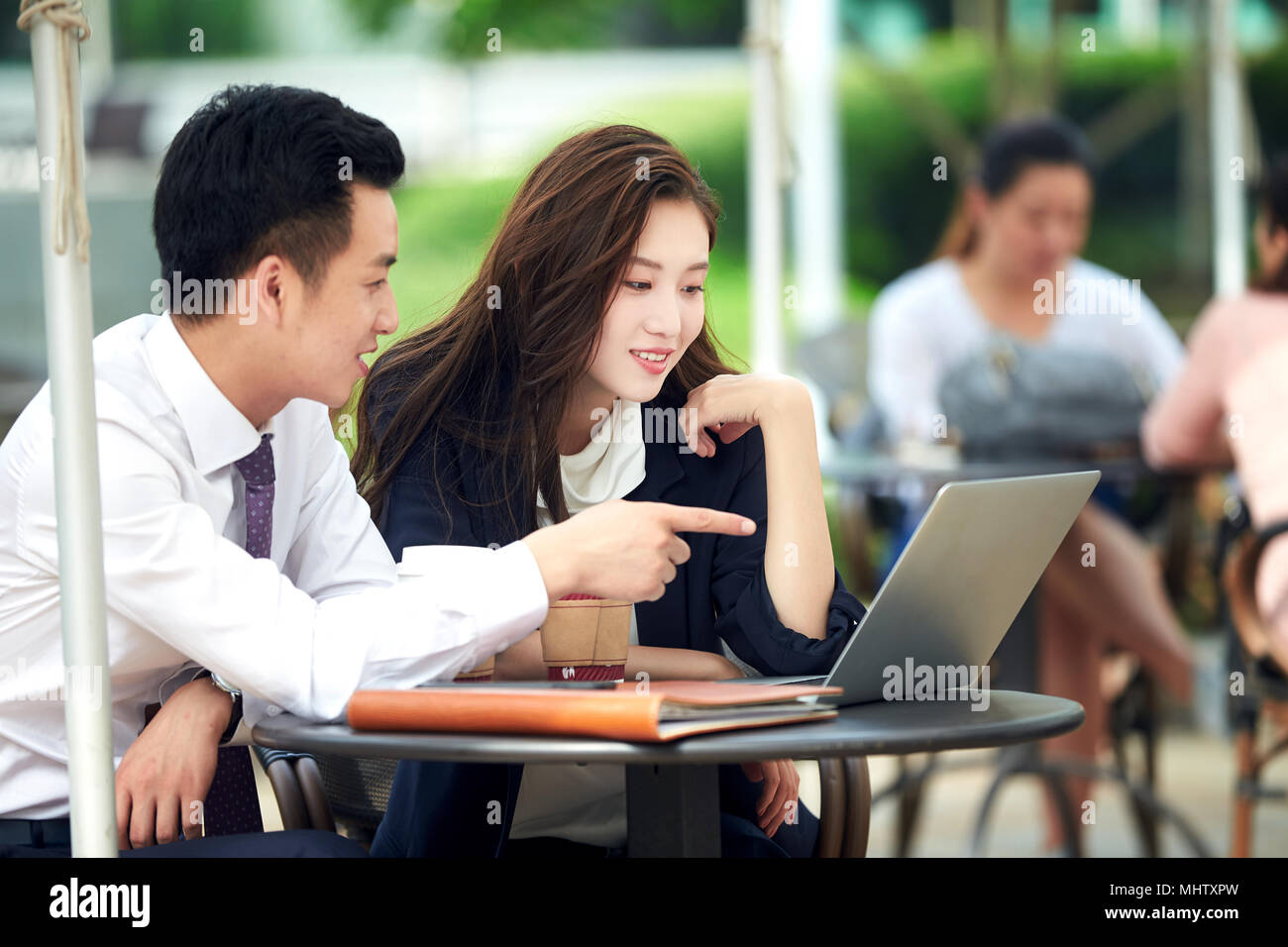 Business people use computers in the outdoor Stock Photo - Alamy