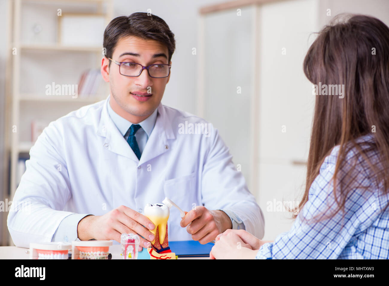 Patient visiting dentist doctor for preliminary appointment Stock Photo ...