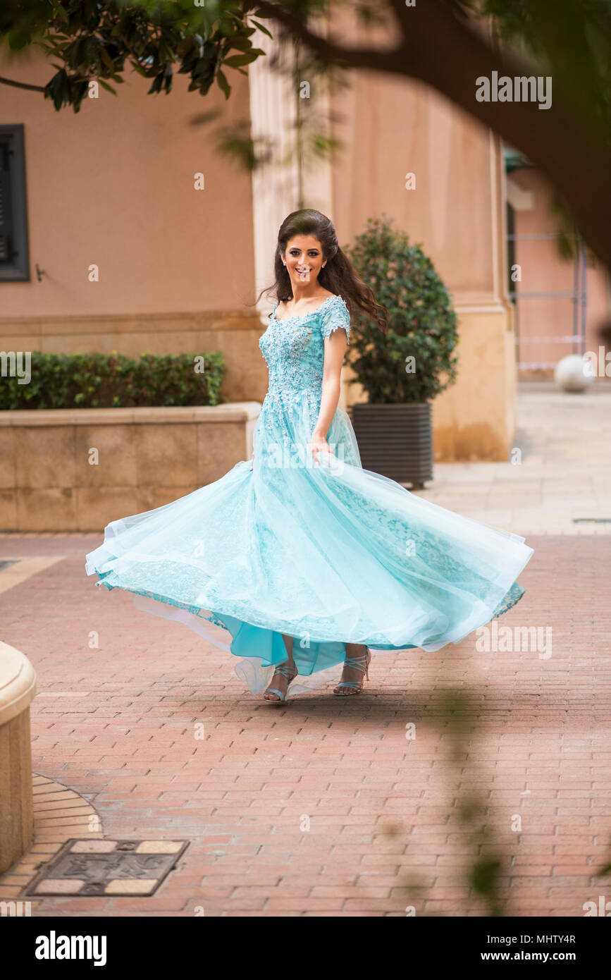 Woman twirling dress hi-res stock photography and images - Alamy