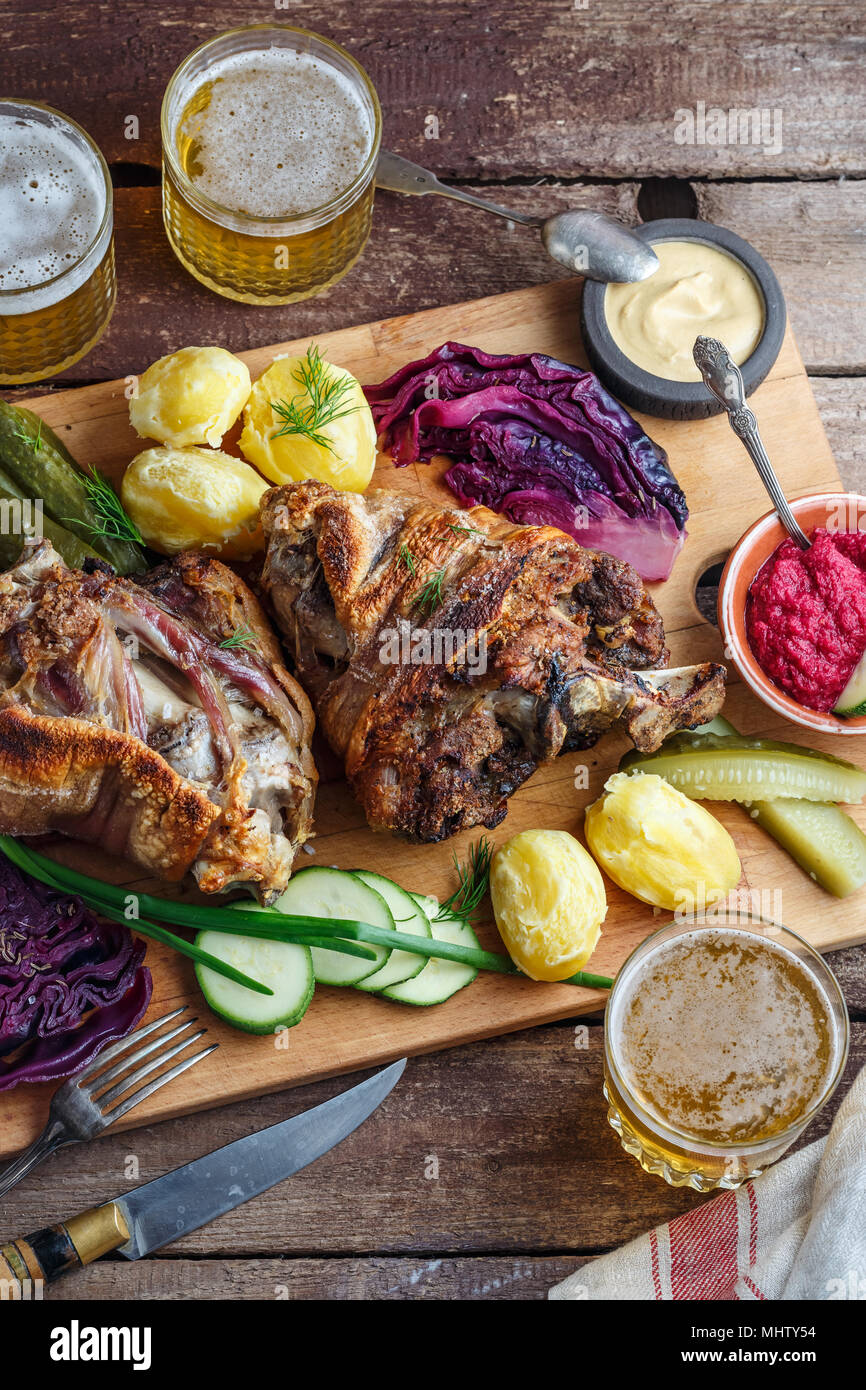 Roasted pork shank with braised boiled cabbage and ros Stock Photo - Alamy