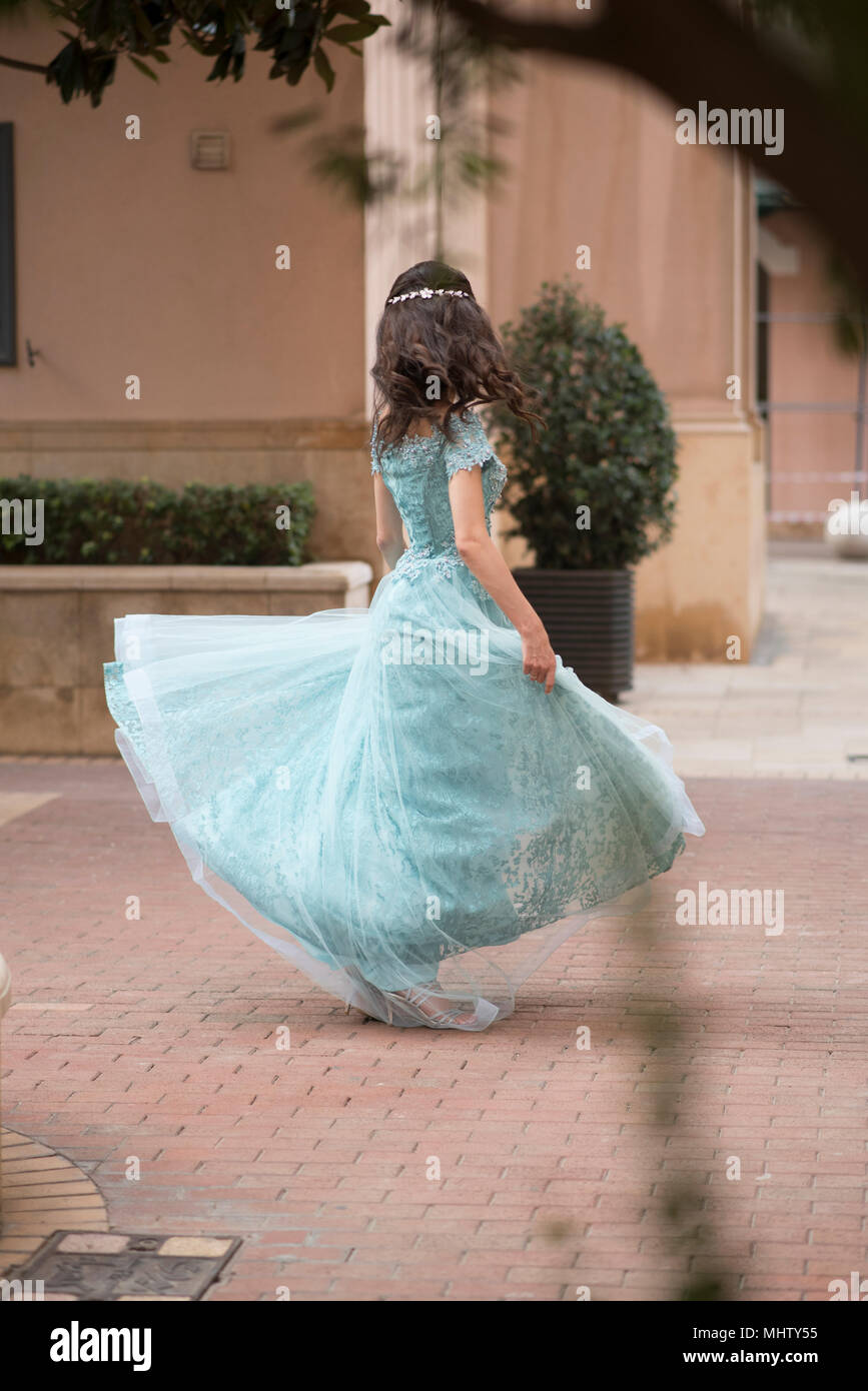 Full length of a woman twirling outdoors Stock Photo - Alamy