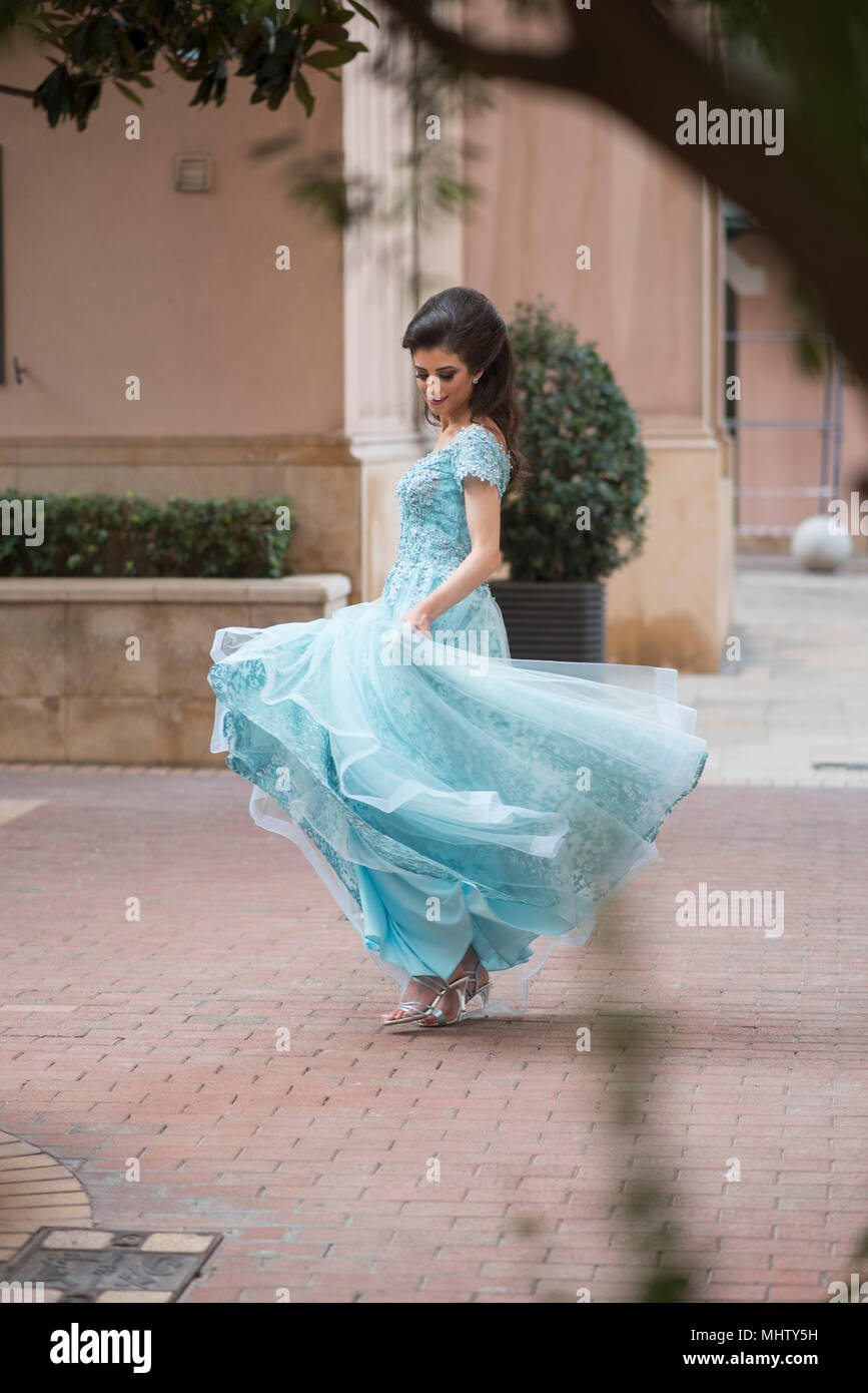 Full length of a woman twirling outdoors Stock Photo - Alamy