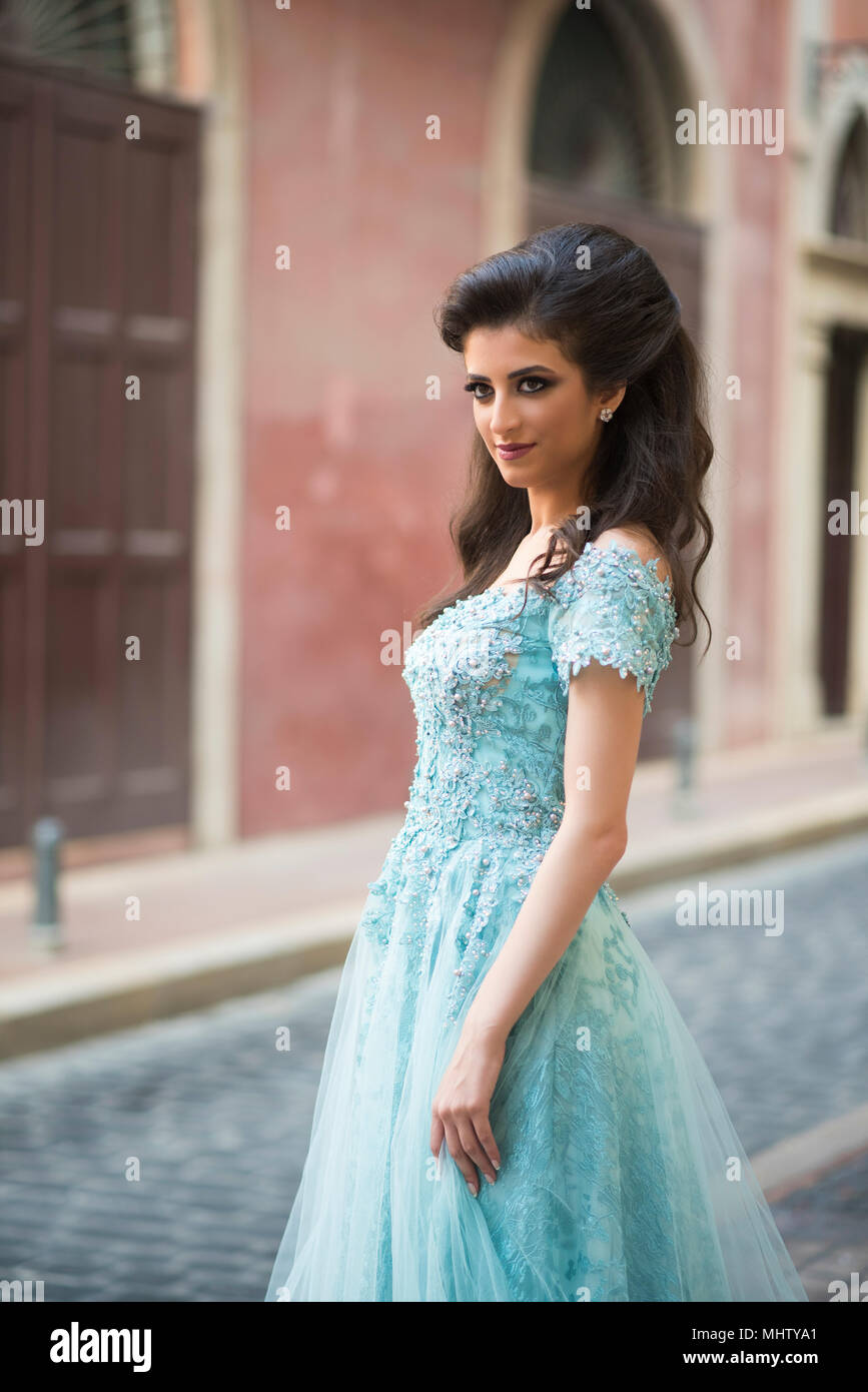 Beautiful woman standing outdoors looking away Stock Photo - Alamy
