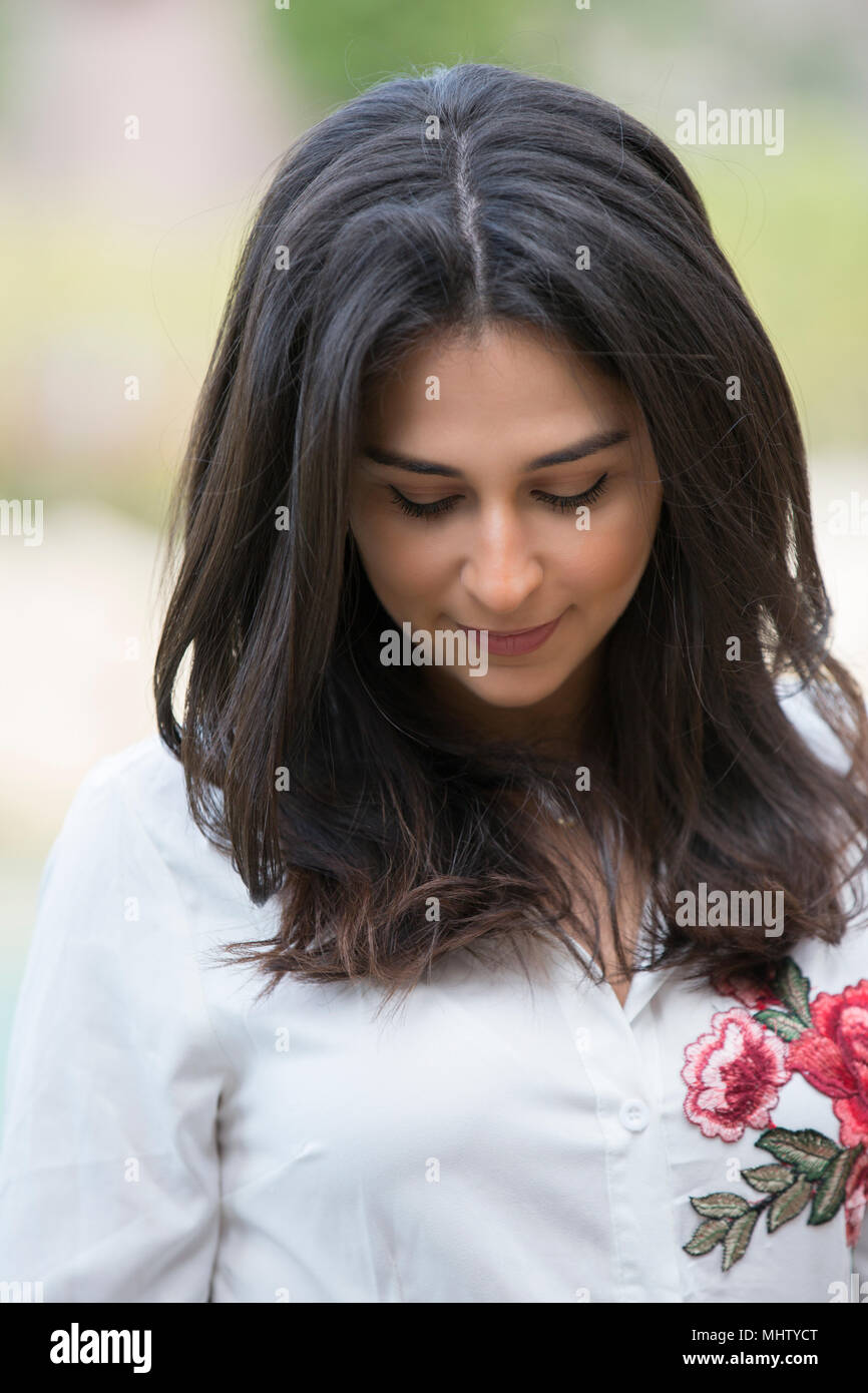 Beautiful woman looking down hi-res stock photography and images - Alamy