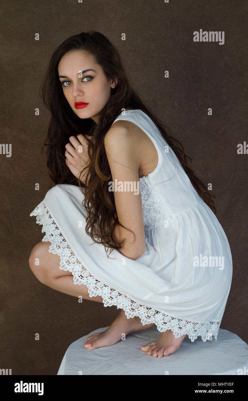 Girl crouching barefoot hi-res stock photography and images - Alamy
