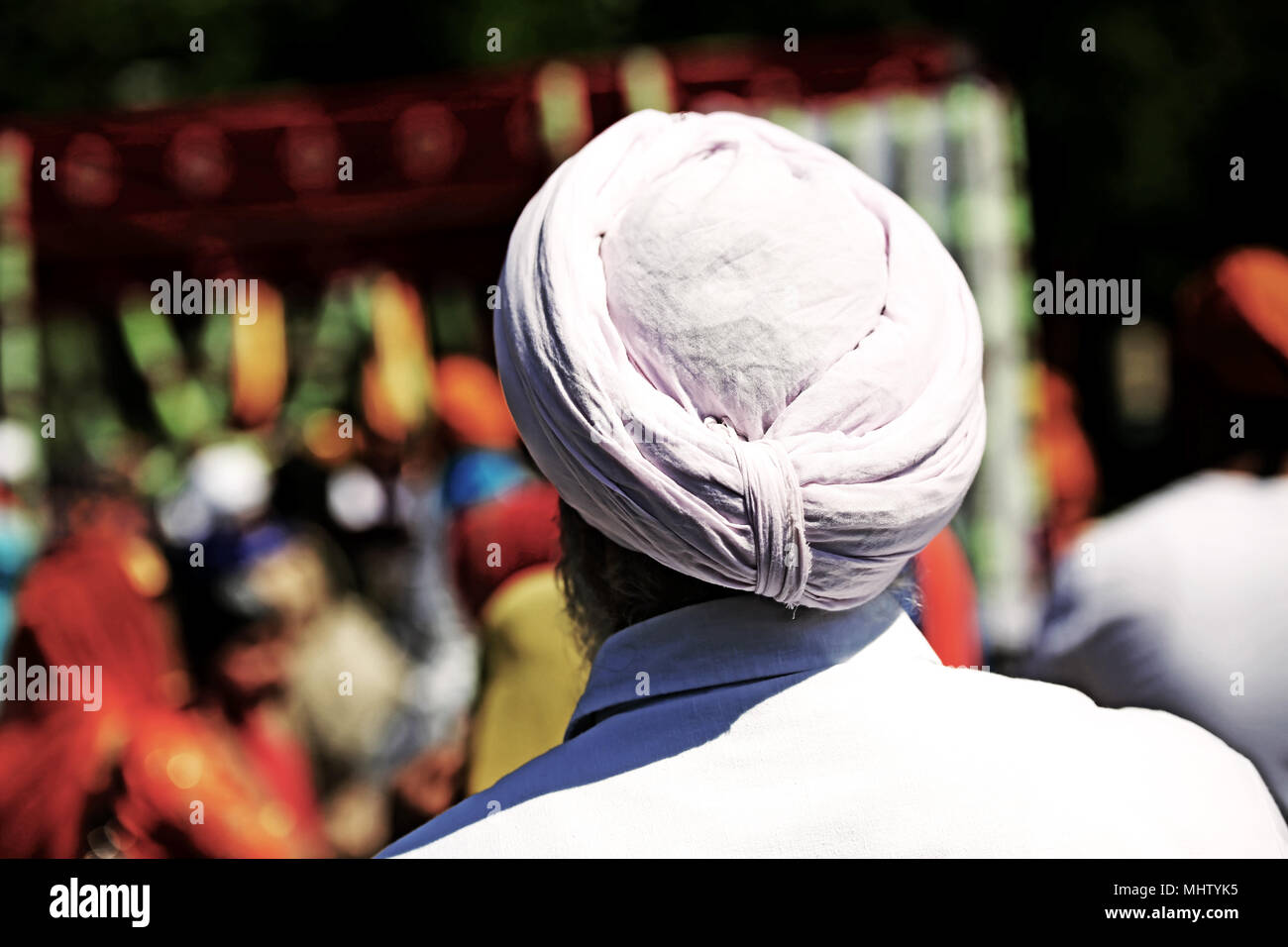 Sikh man with pink turban and long white beard during the religious ...