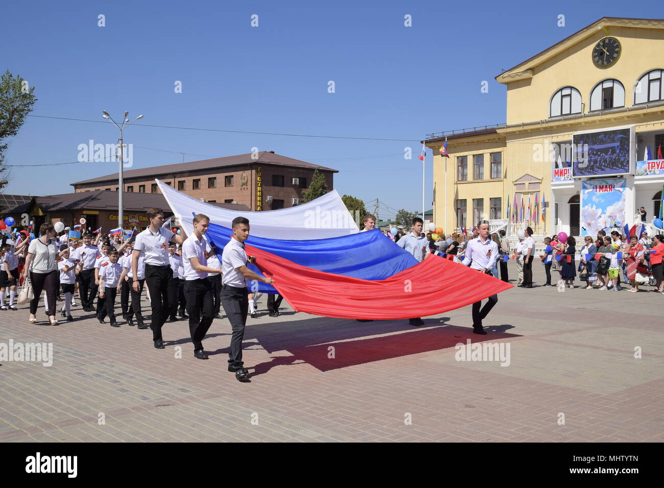 Slavyansk-on-Kuban, Russia - May 1, 2018: Solemn carrying of the flag ...