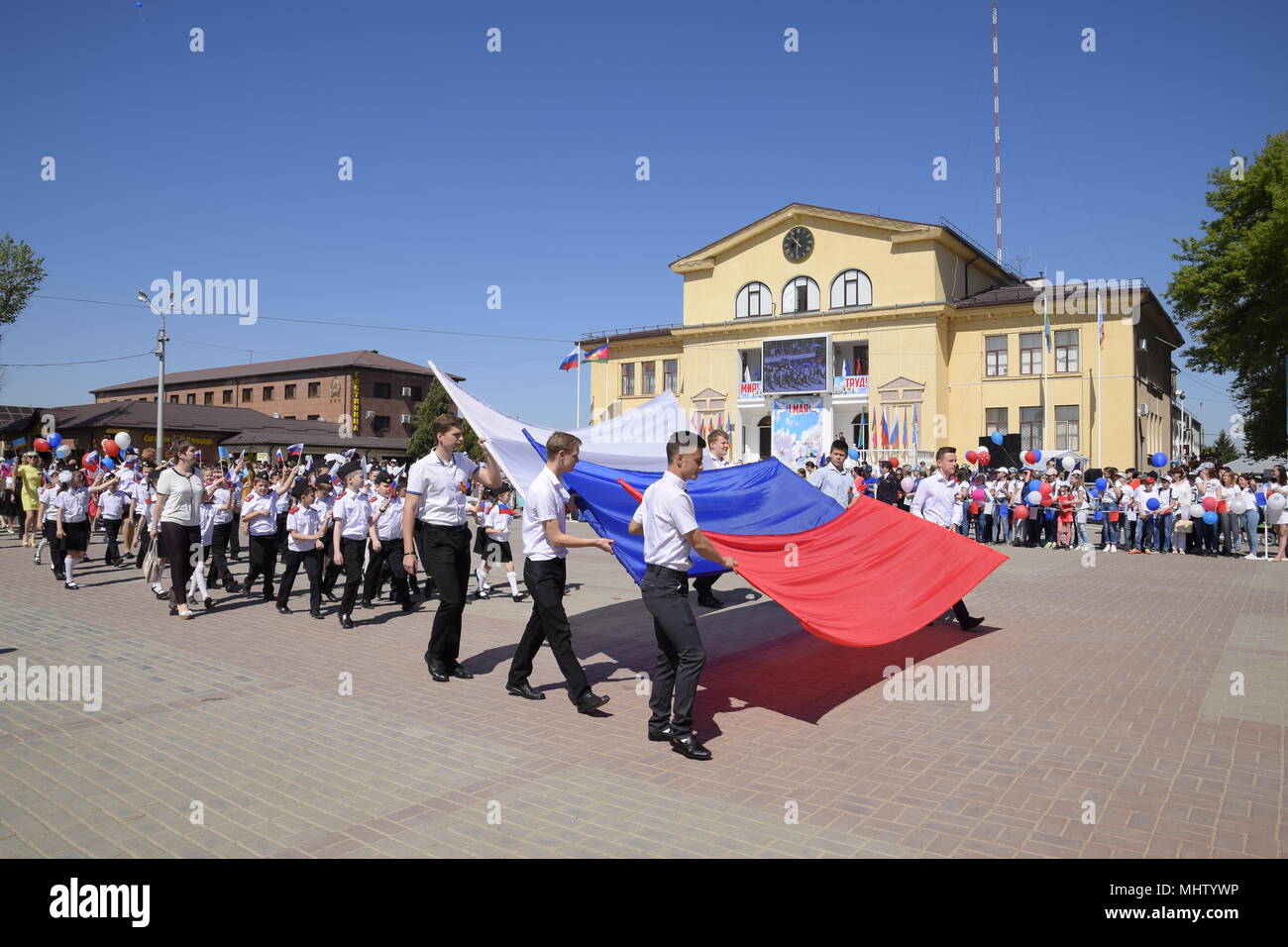 Slavyansk-on-Kuban, Russia - May 1, 2018: Solemn carrying of the flag ...