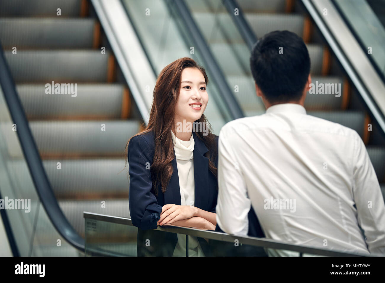Business people talking in the elevator Stock Photo - Alamy